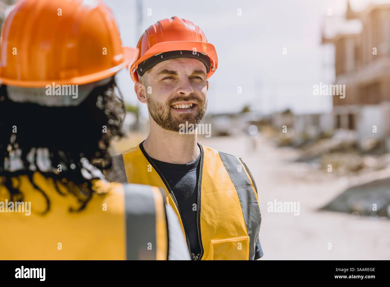 Construction worker happy smile, Caucasian engineer male standing wearing safety vest and helmet ...