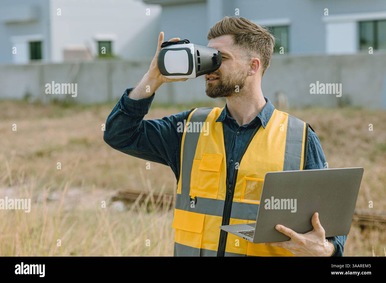 Engineer male worker using Visual reality VR or Augmented reality AR ...