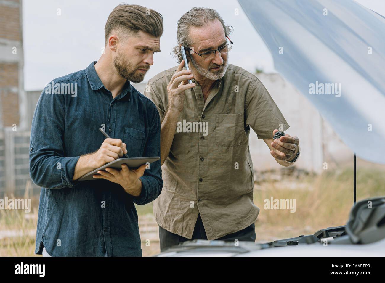 Senior male with car problem broken standing talking discussion with ...