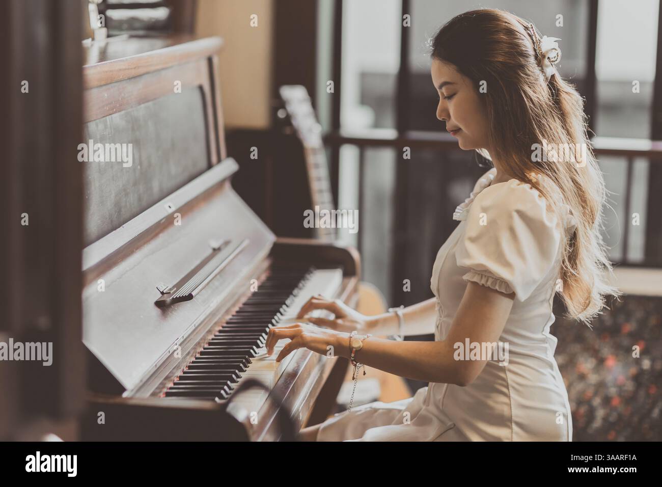 Musician pianist playing music with old wooden piano brown vintage ...