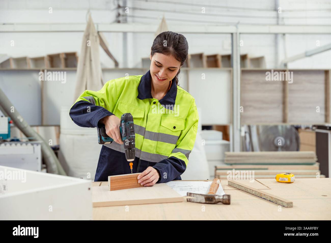 Professional women staff worker enjoy working drilling assembly plywood ...