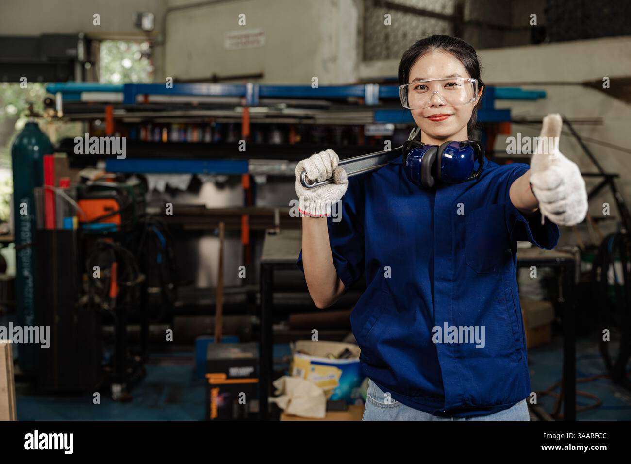 Portrait engineer women working in Lathe shop with metal machinery ...