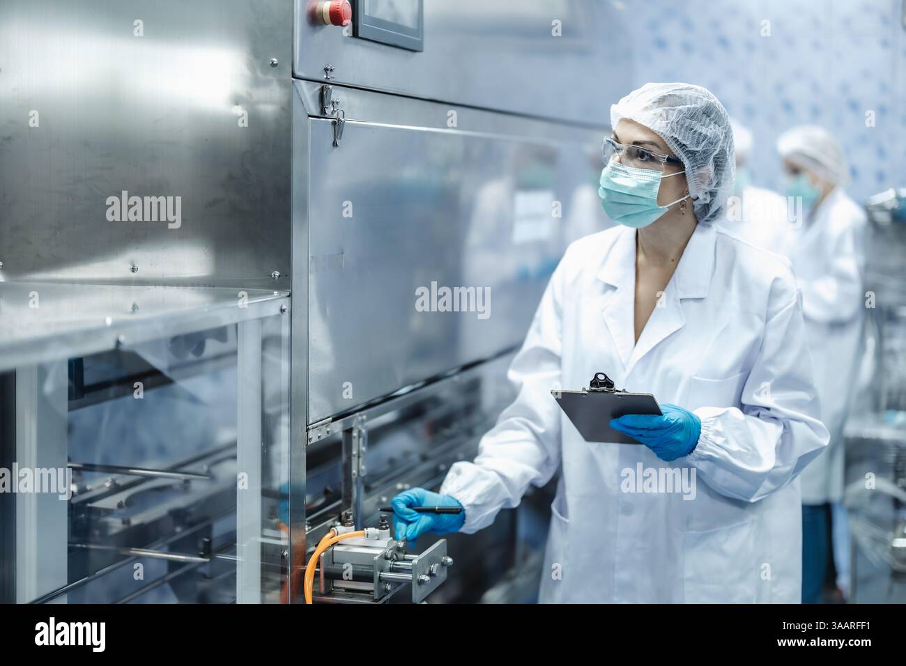 Industry inspector team working, QC staff work checking machine operation for safety and hygiene ...