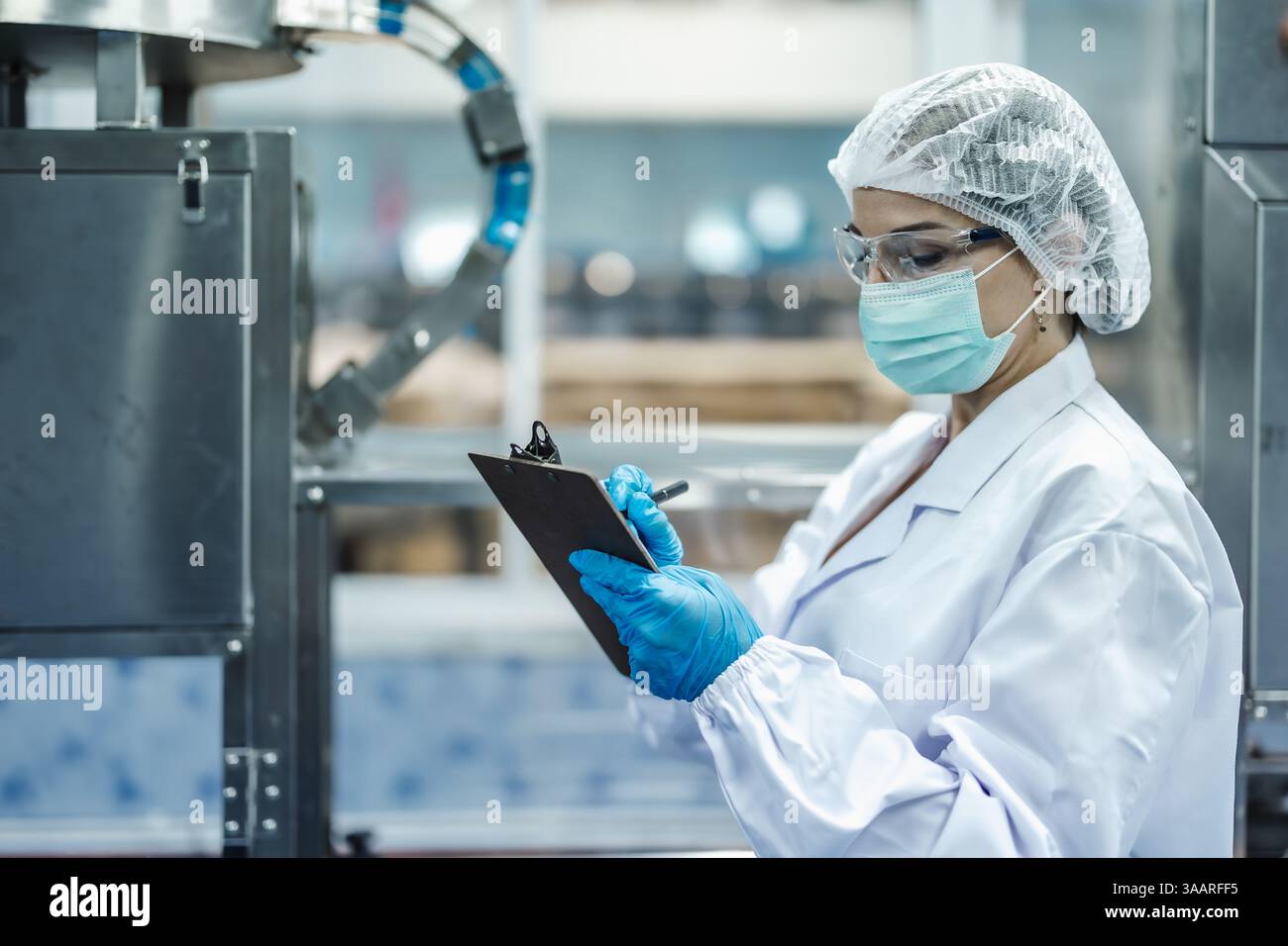 Industry inspector team working, QC staff work checking machine operation for safety and hygiene ...