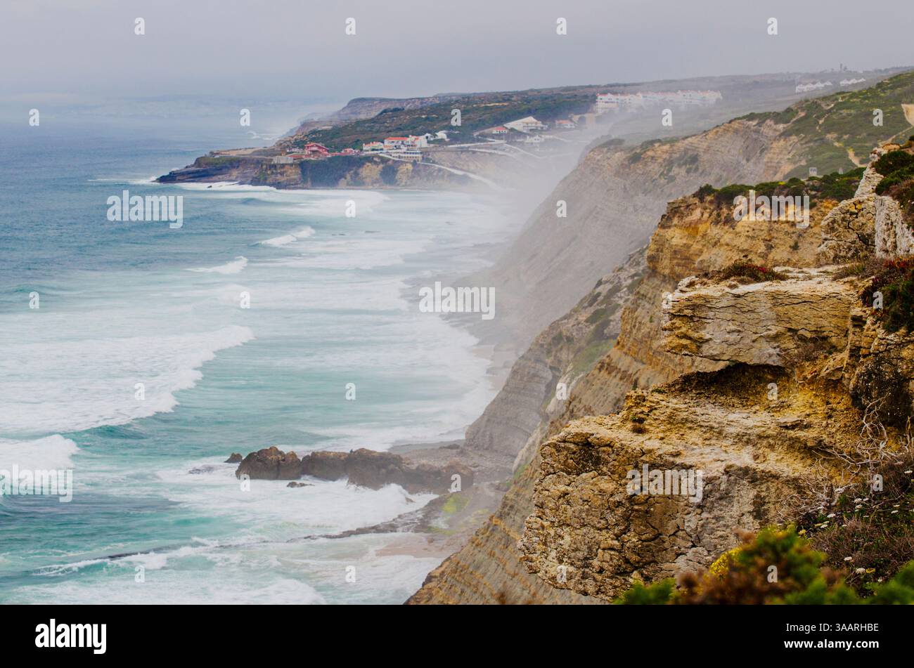 Azenhas do Mar and the magic cliffs deep down into the wild ocean Stock ...