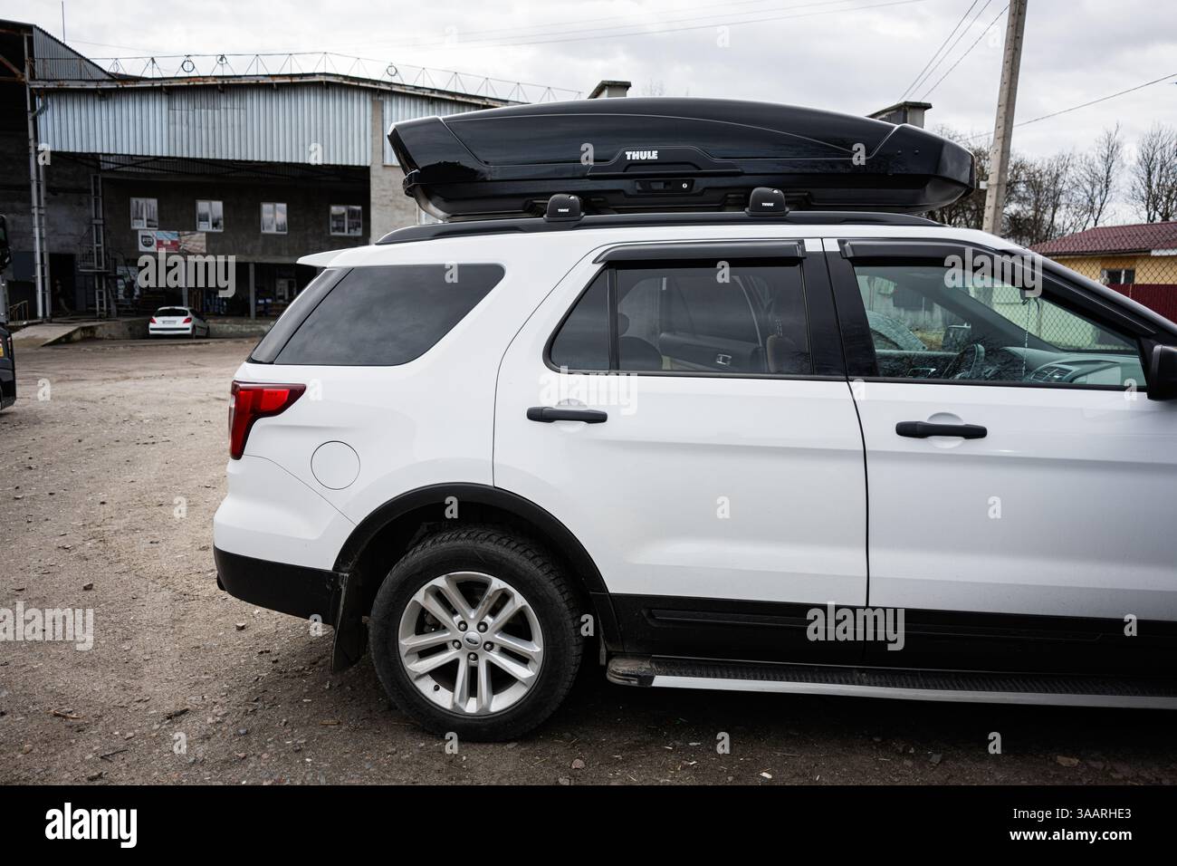 Lviv, Ukraine - March 31, 2025: A white Ford Explorer SUV parked with a ...
