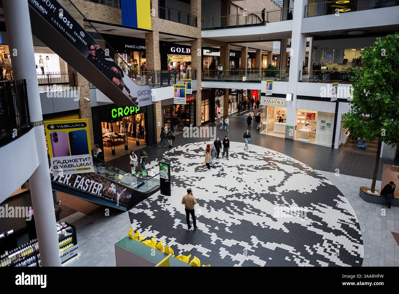 Lviv, Ukraine - March 31, 2025: People enjoying a modern Forum Lviv ...