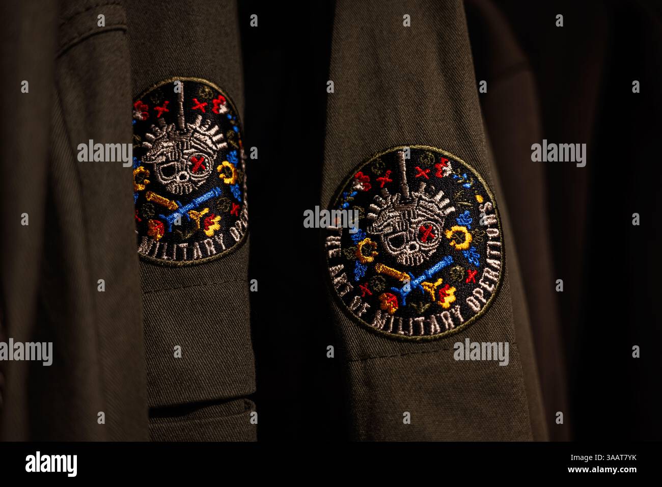 Lviv, Ukraine - March 31, 2025: Detailed view of an olive green jacket ...