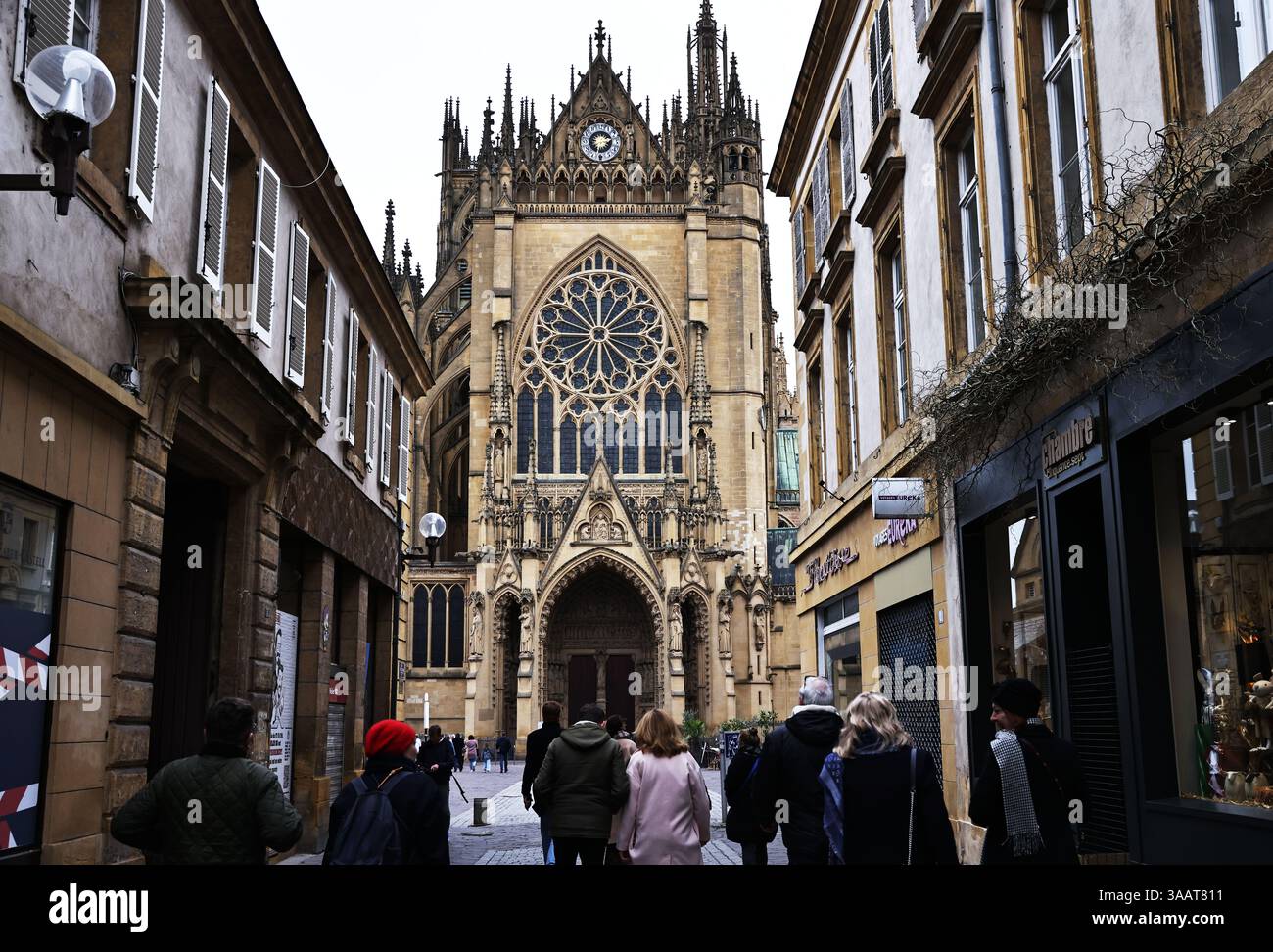 Metz, France. 30th Mar, 2025. People take a walk in the historical ...
