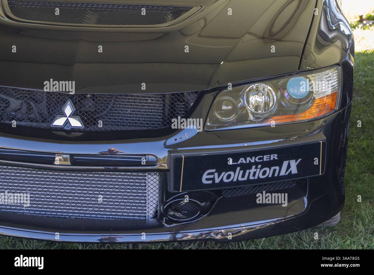 Close up view of the front end of a black mitsubishi lancer evolution ...