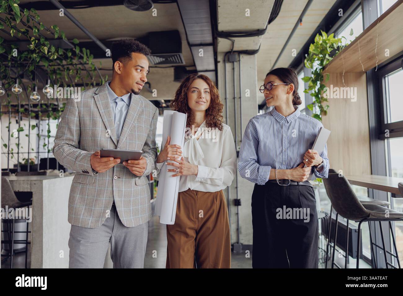 Engaging in a Collaborative Team Meeting within a Dynamic and Modern Office Space Setting Stock ...