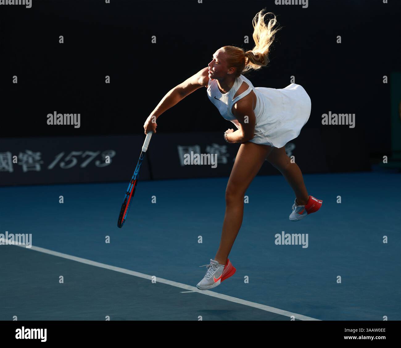 Russian junior tennis player Anastasia Lizunova playing a service shot ...