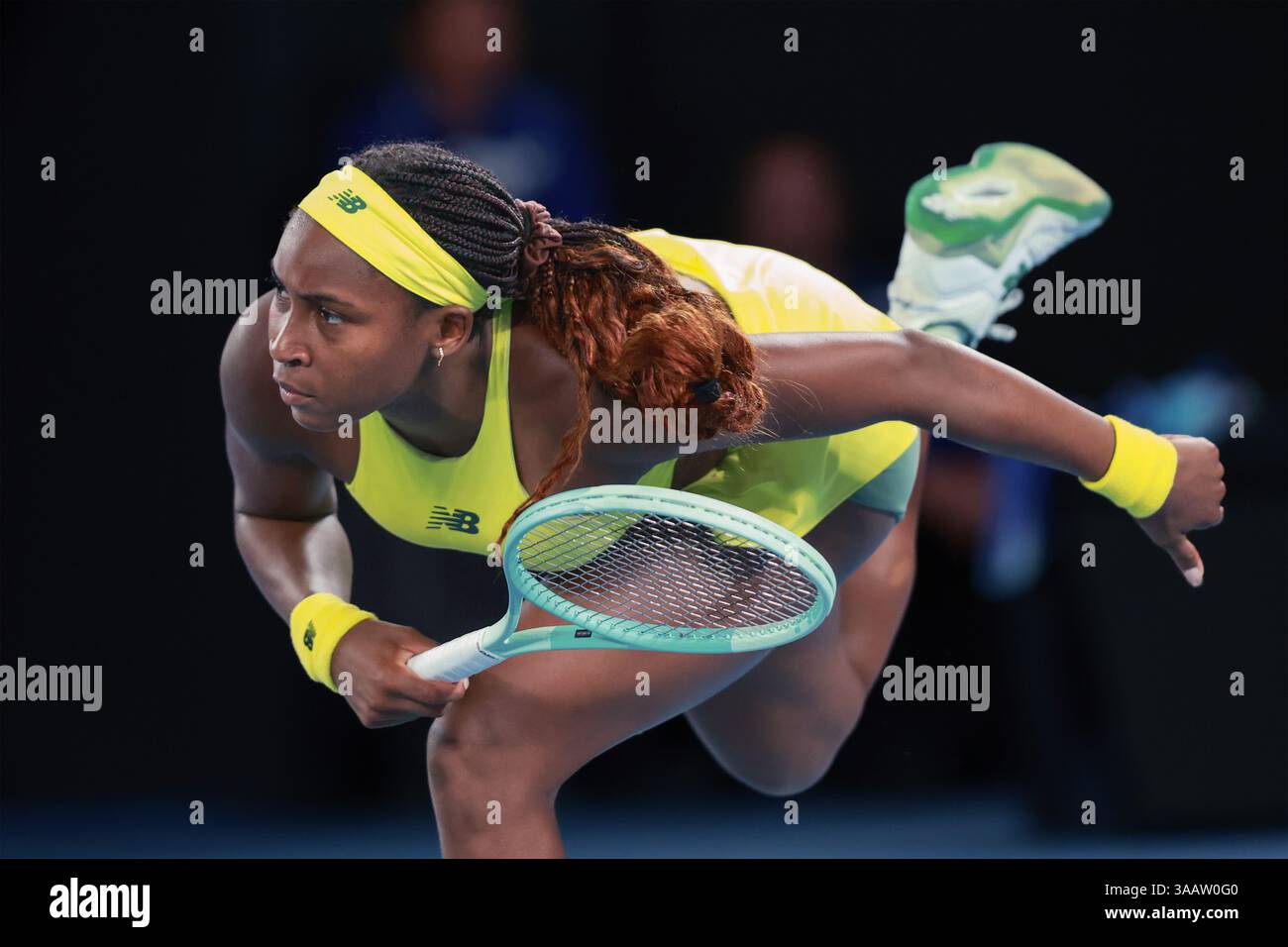 American tennis player Coco Gauff (USA) playing a service shot at the Australian Open 2025 ...