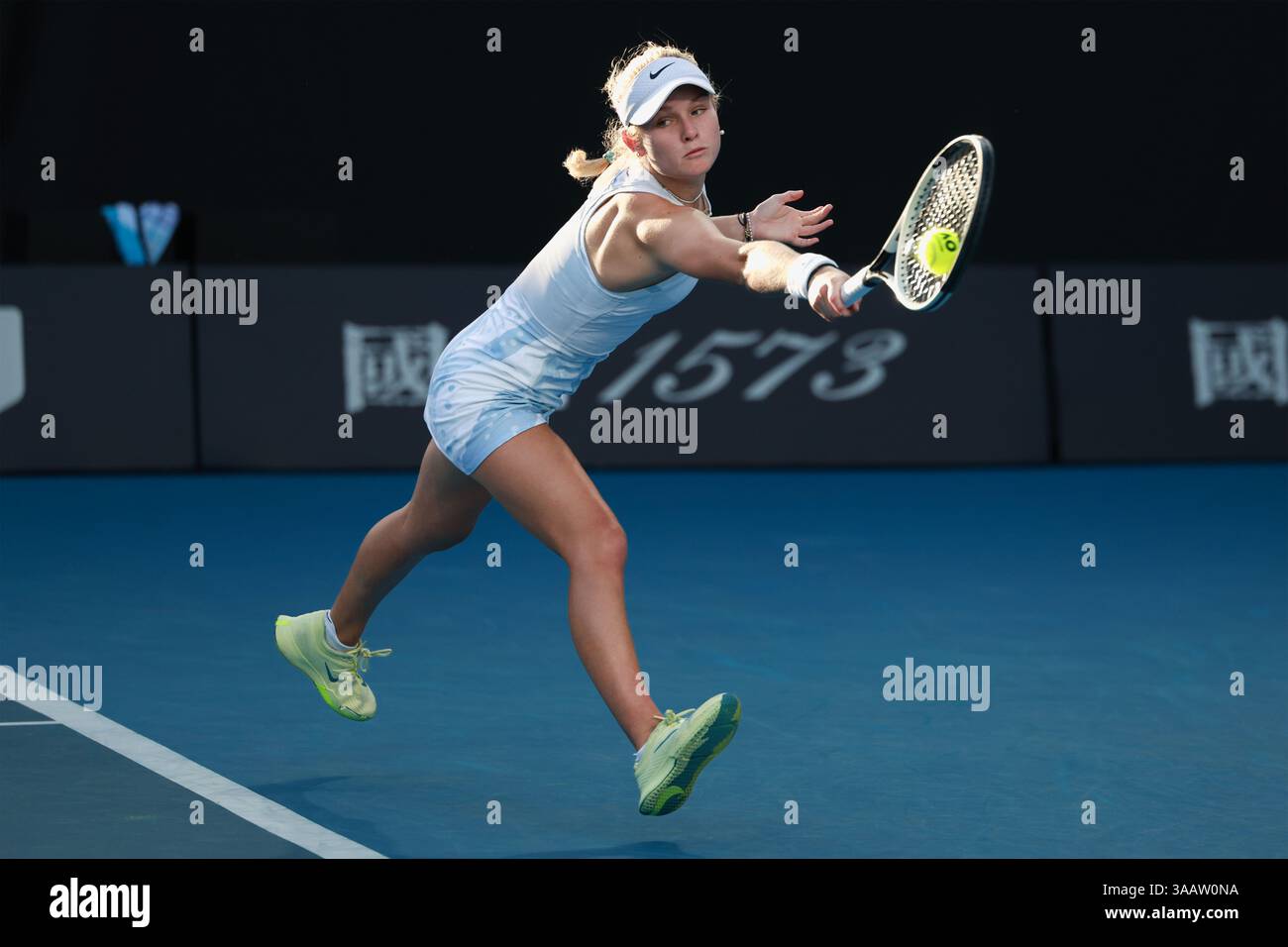 Australian junior tennis player Emerson Jones (AUS) playing a backhand ...