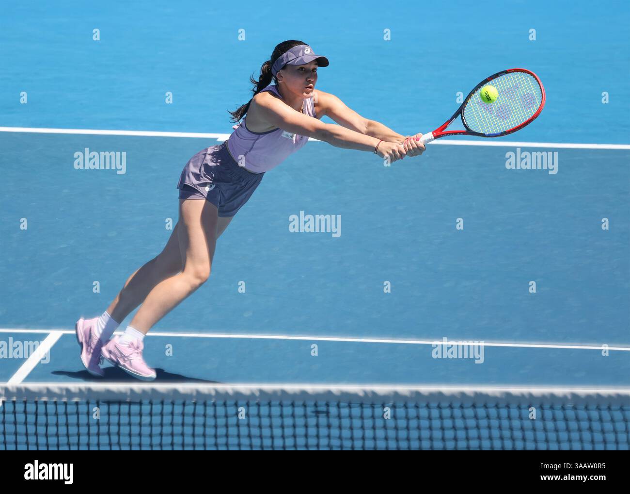 German tennis player Eva Lys (GER) playing a backhand volley at the Australian Open 2025 ...