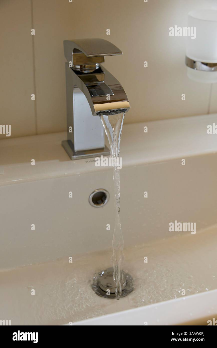 Clear clean water flows from the tap Stock Photo - Alamy