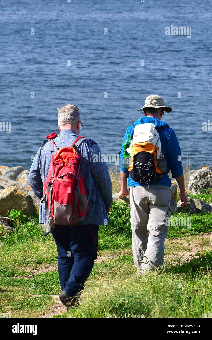 Two pilgrims to Santiago de Compostela on the shores of the Atlantic ...