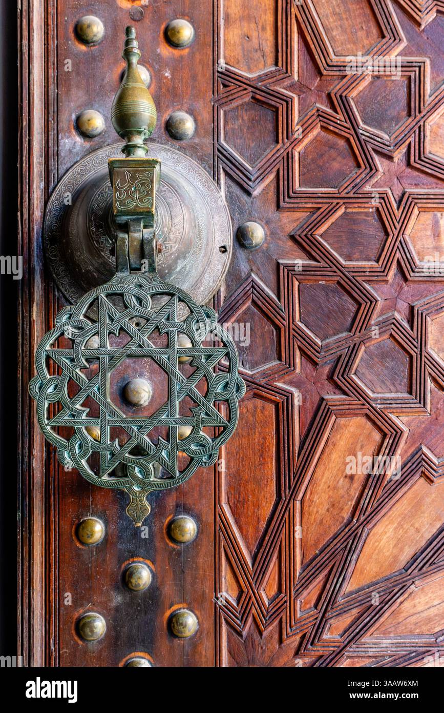 Beautifully carved wooden door and brass door handle in the Paris ...