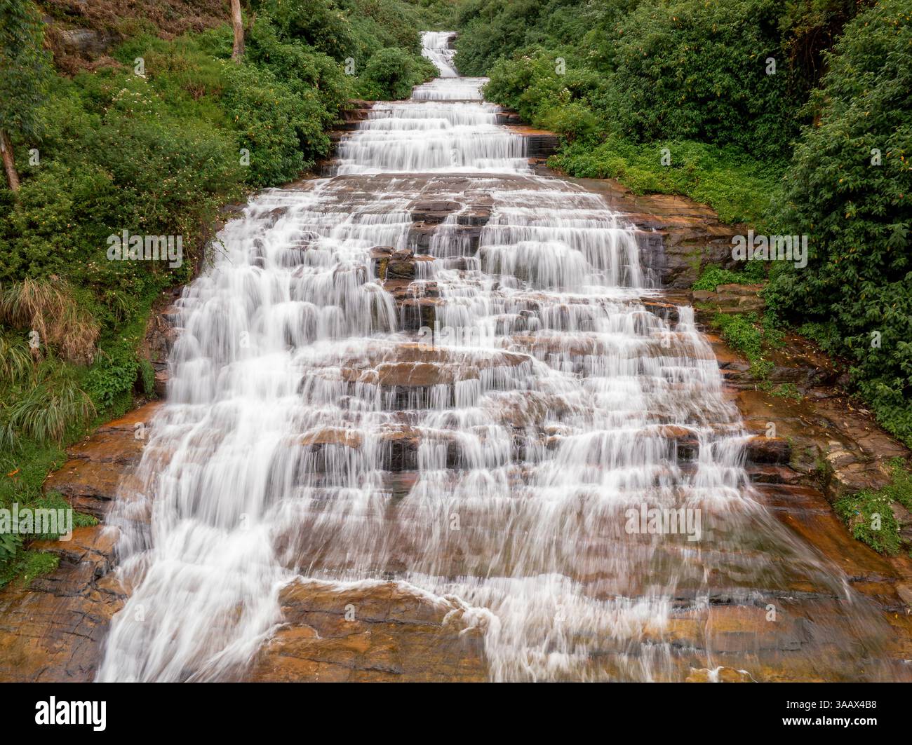 The Nanu Oya Waterfalls cascade through lush tea plantations in Sri ...