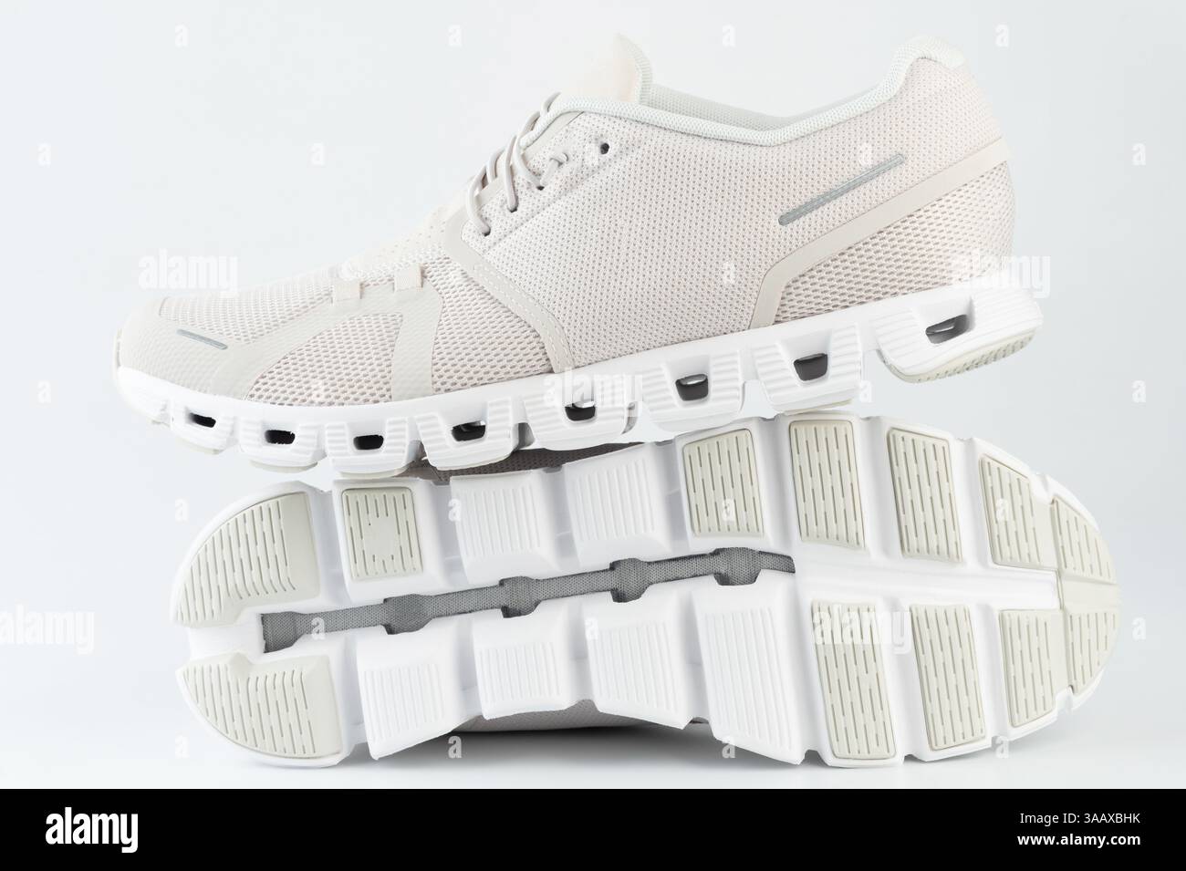 Light running white shoes isolated on studio background Stock Photo - Alamy