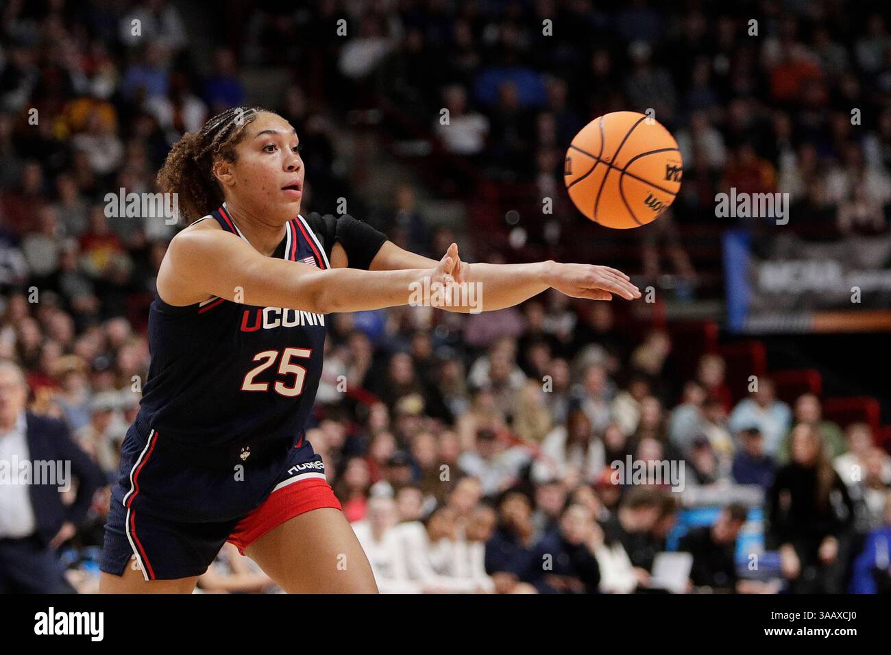 UConn forward Ice Brady (25) passes the ball during the first half ...