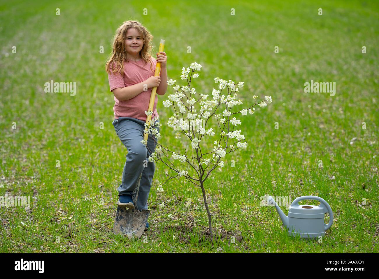 Teen boy planting trees hi-res stock photography and images - Alamy