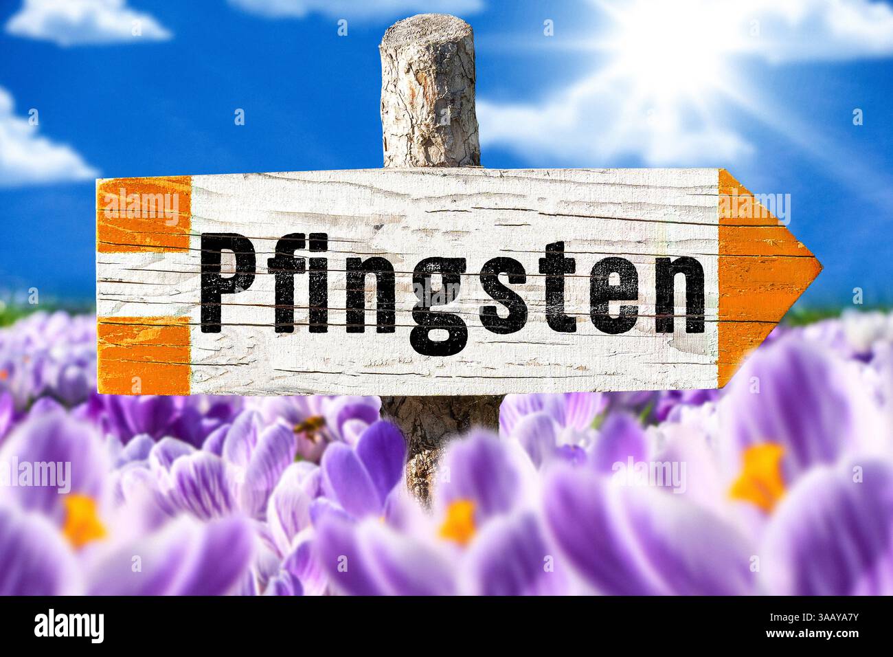 Germany - April 1, 2025: PHOTOMONTAGE, Pentecost lettering on a wooden ...