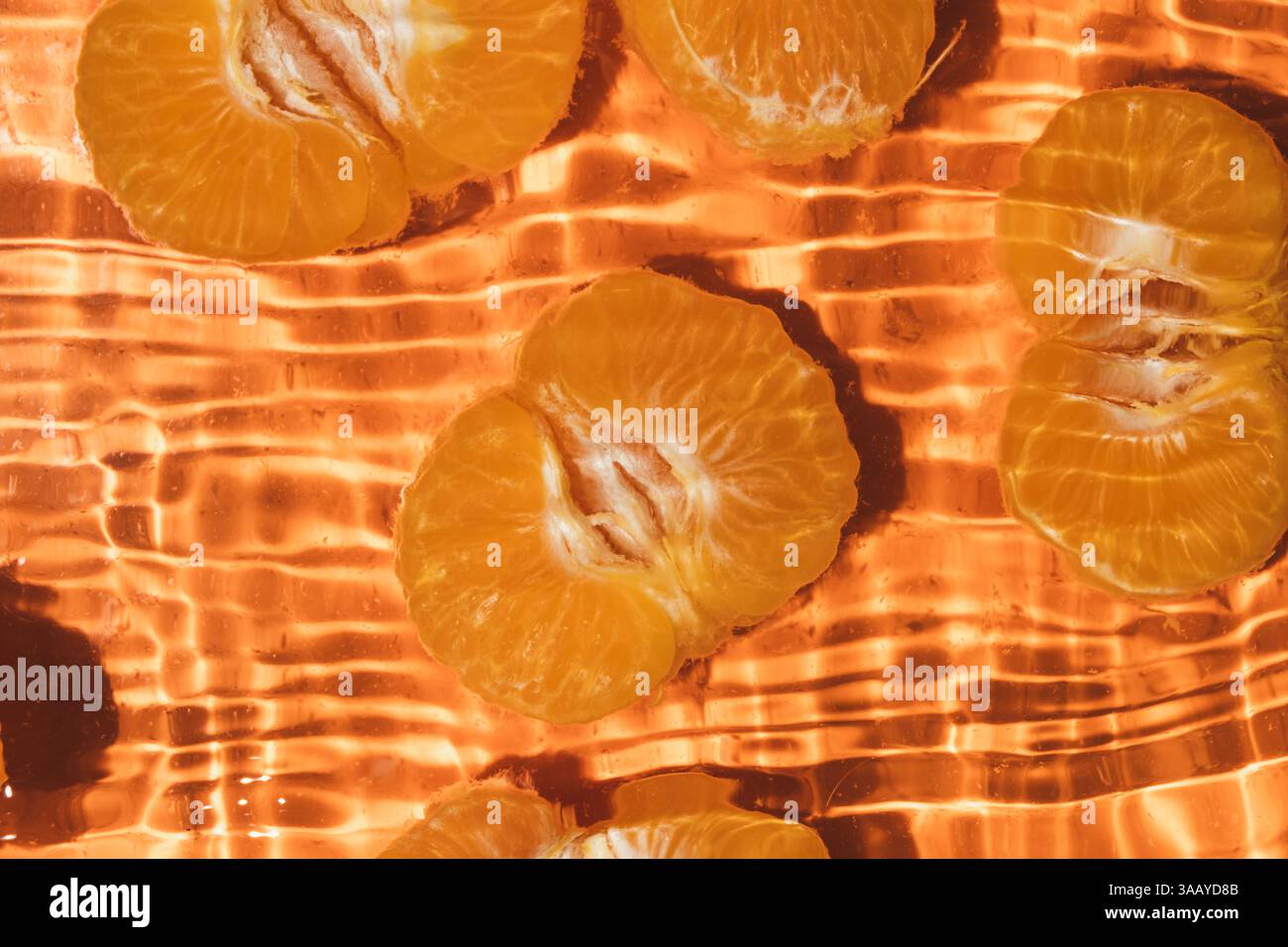Peeled fresh mandarin halves in water, splash water, top view Stock ...