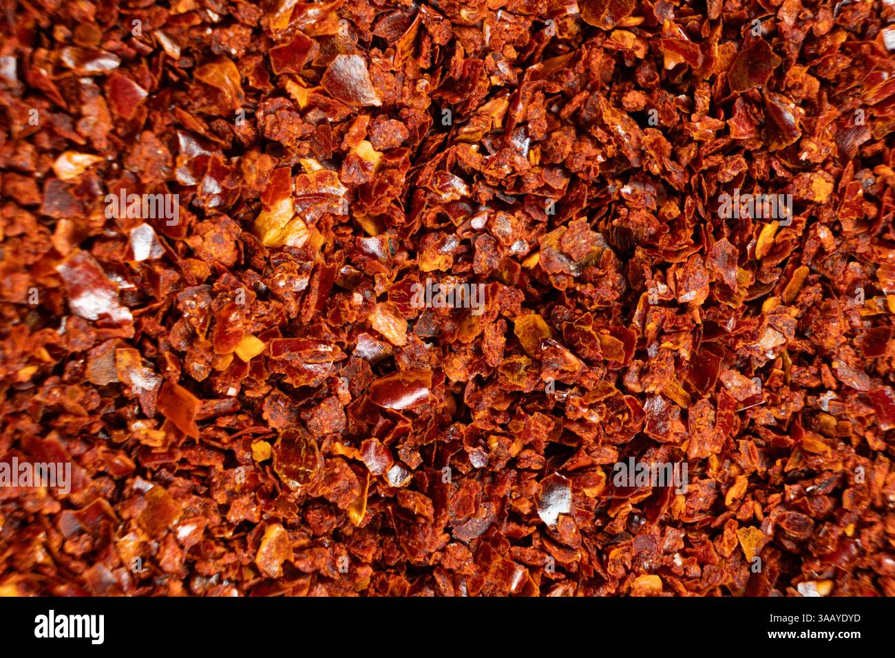 Spicy ground chili pepper close-up texture top view Stock Photo - Alamy