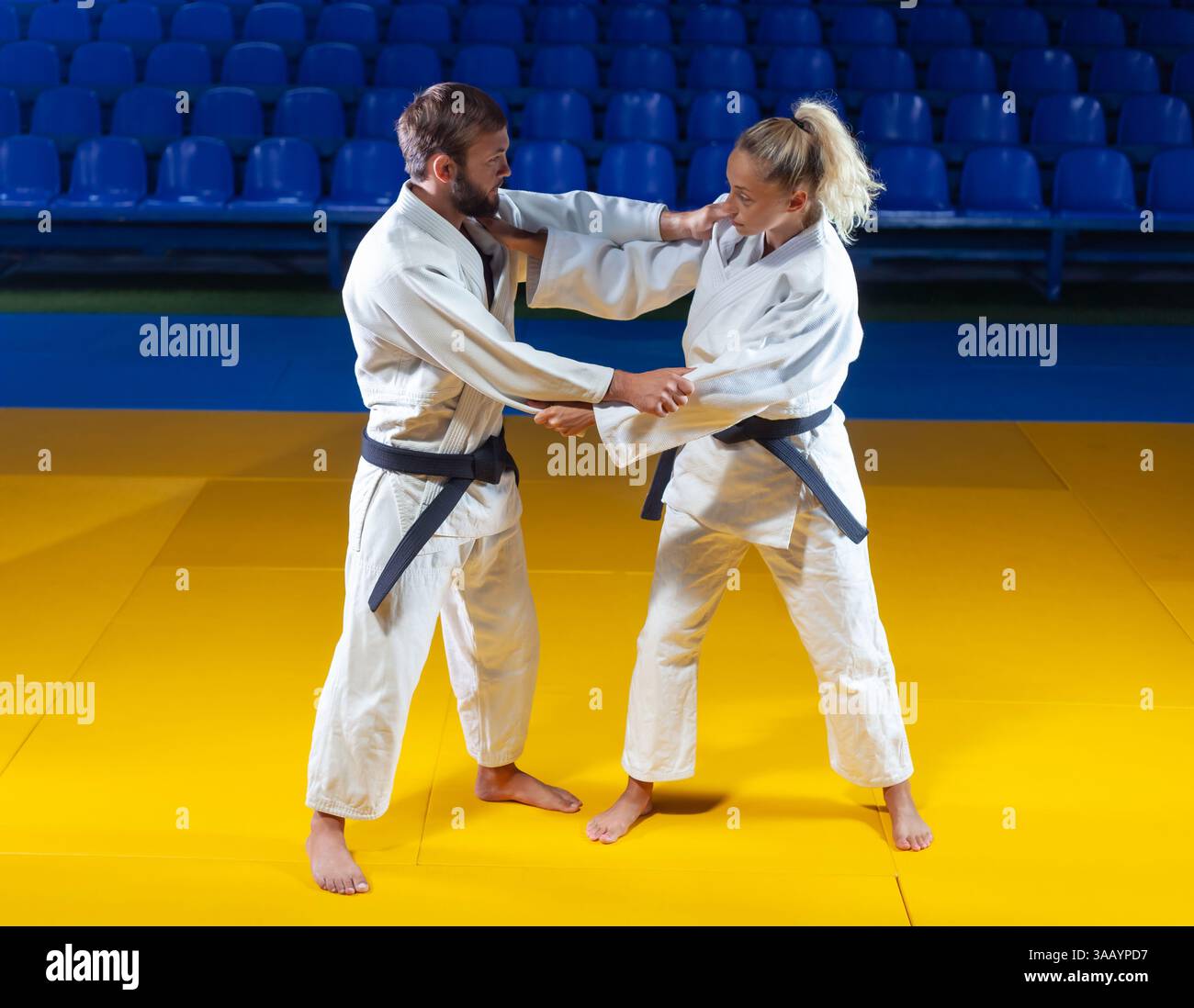 Martial arts. Sparing Portners. Sport man and woman in white kimono ...