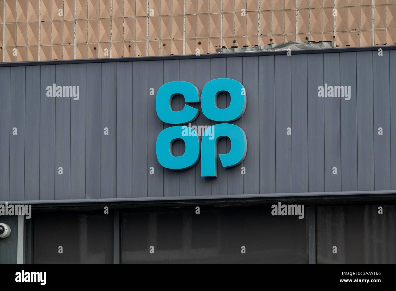 The Co Op company logo on the side of one of their convenience stores ...