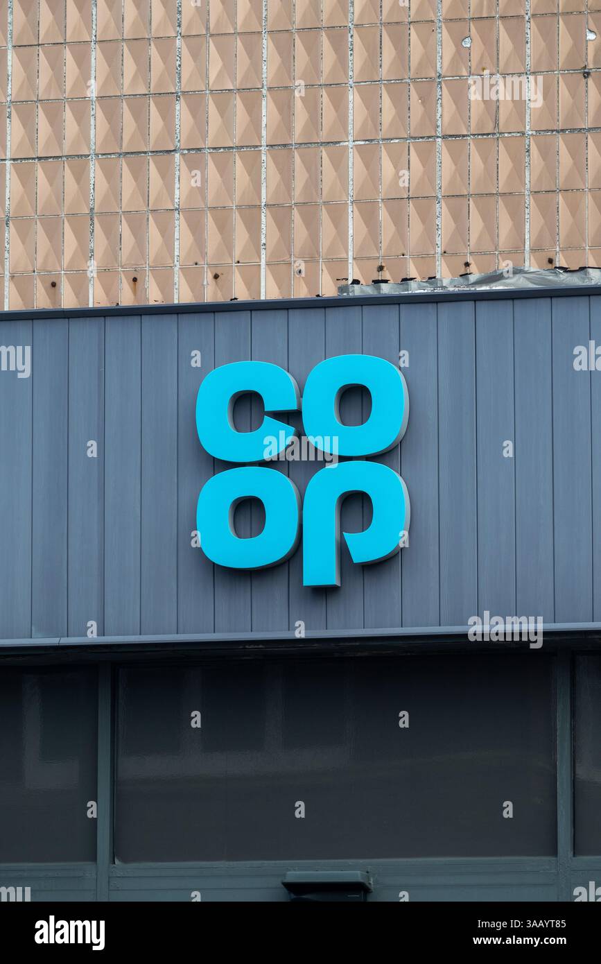 The Co Op company logo on the side of one of their convenience stores ...
