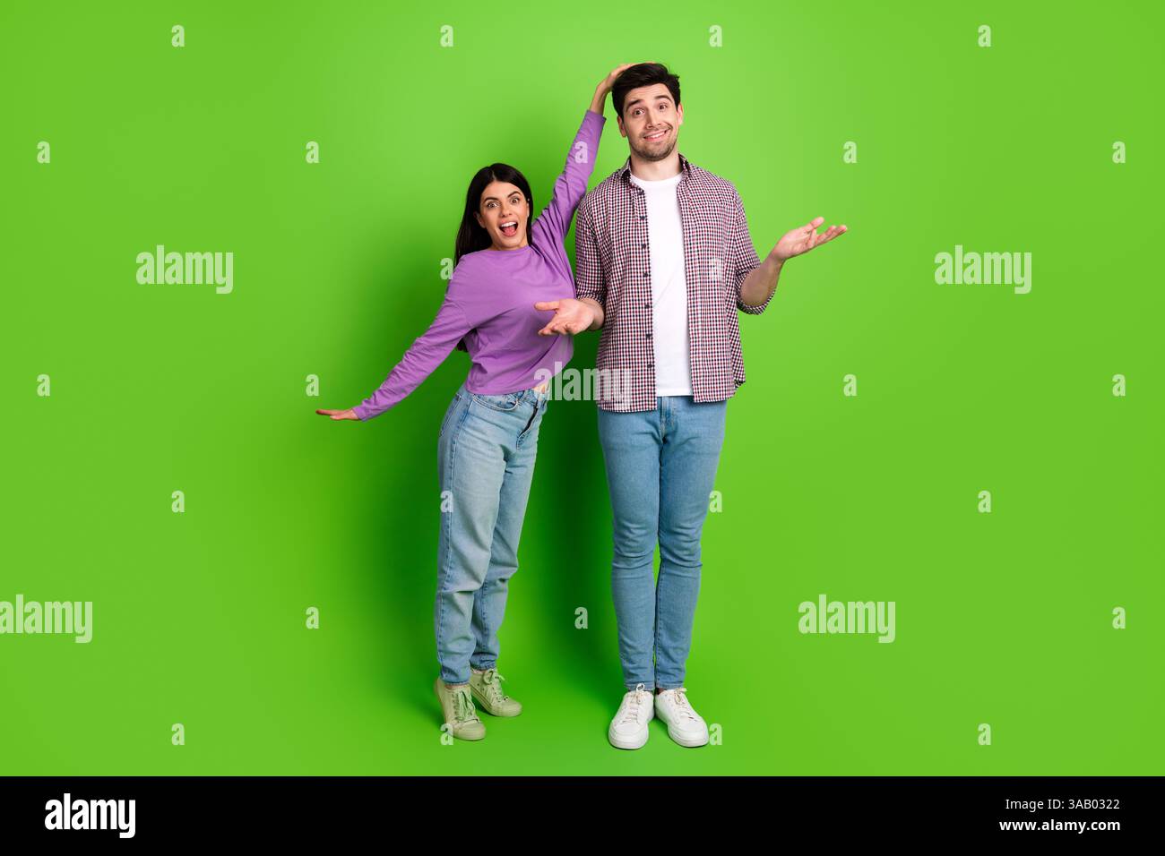 Happy young couple making playful gestures and having fun together ...