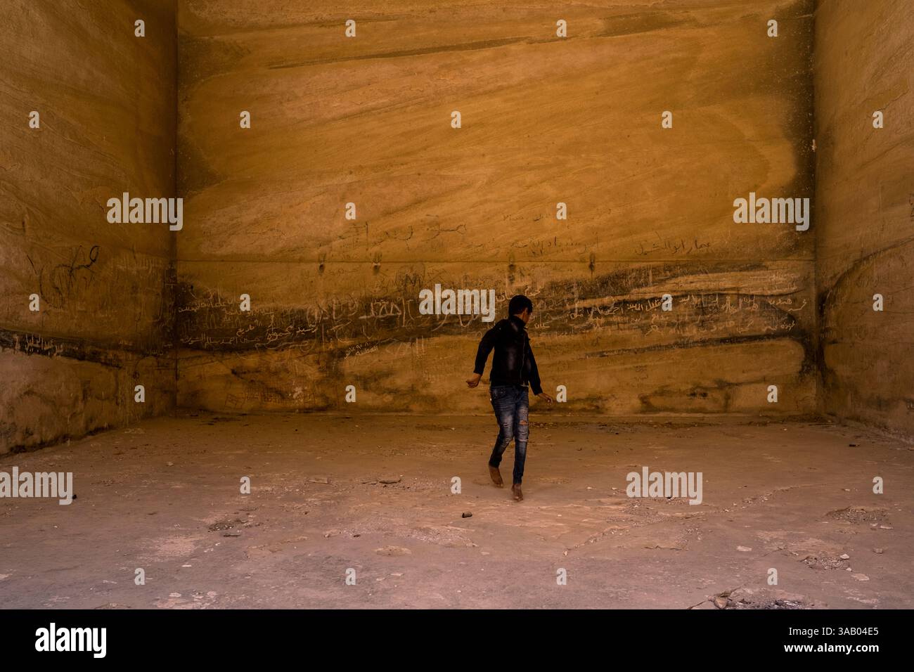WADI MUSA, JORDAN - 10 SEPTEMBER 2021: Kid inside of a cave on Little ...