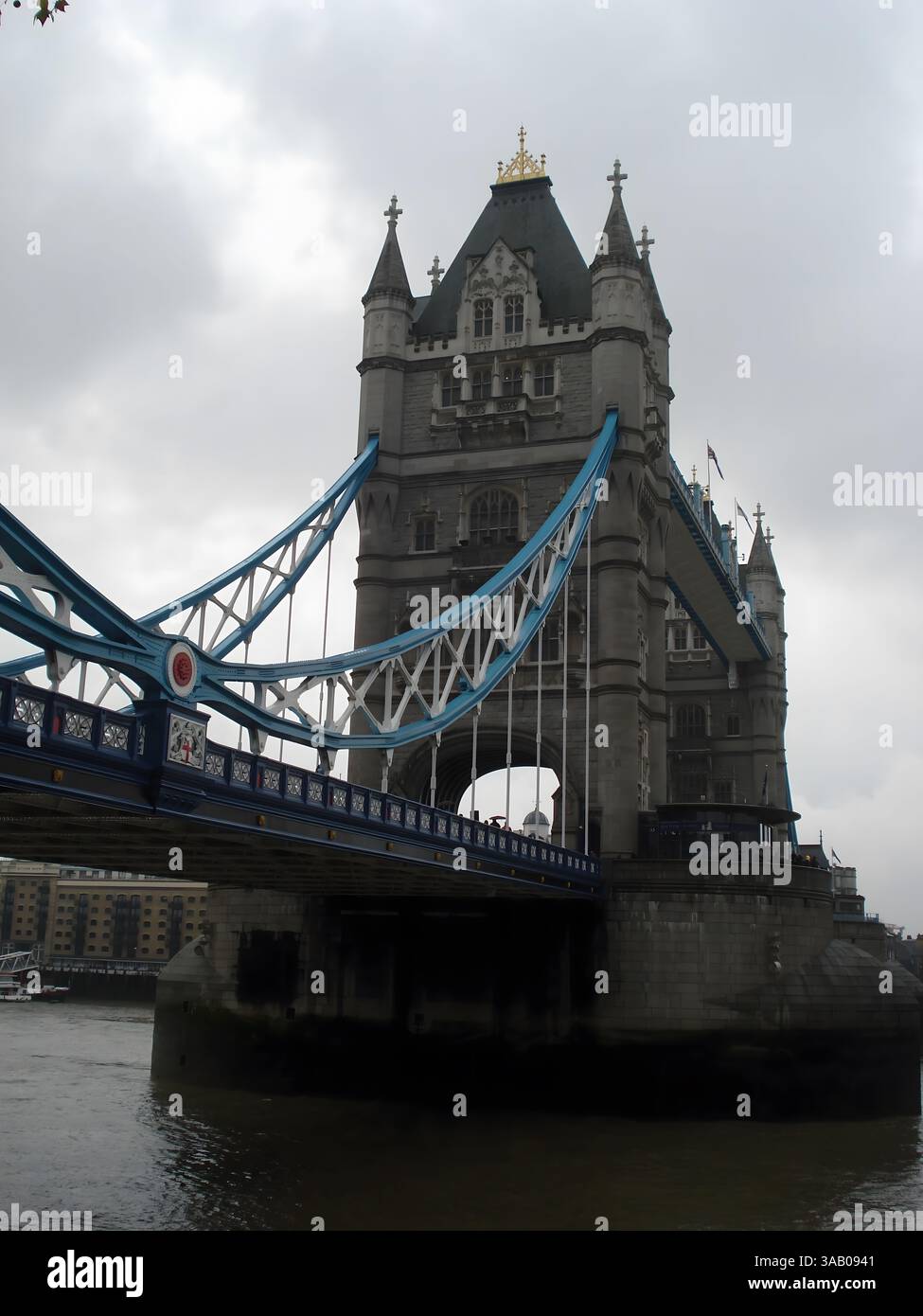 A view of Tower Bridge in London with its iconic blue suspension cables ...