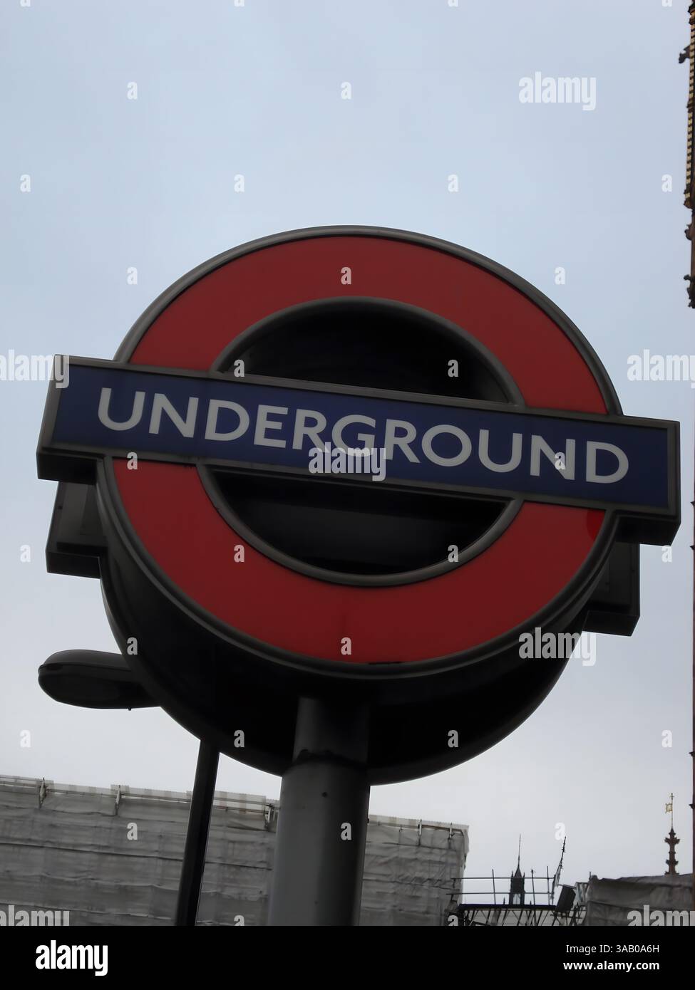 A close-up view of a London Underground sign, featuring the iconic red ...