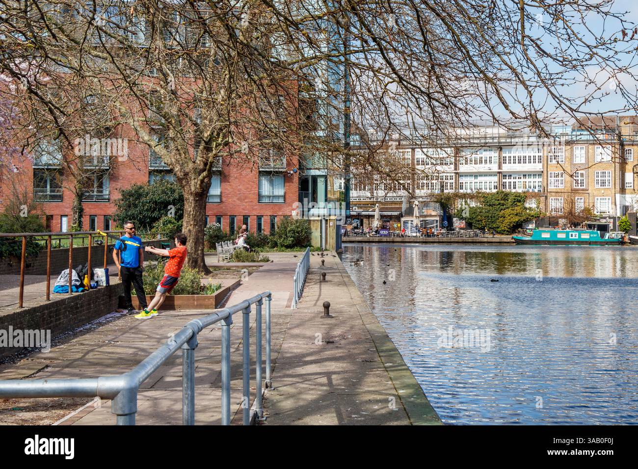 People exercising in Graham Street Park next to City Road Basin, London ...