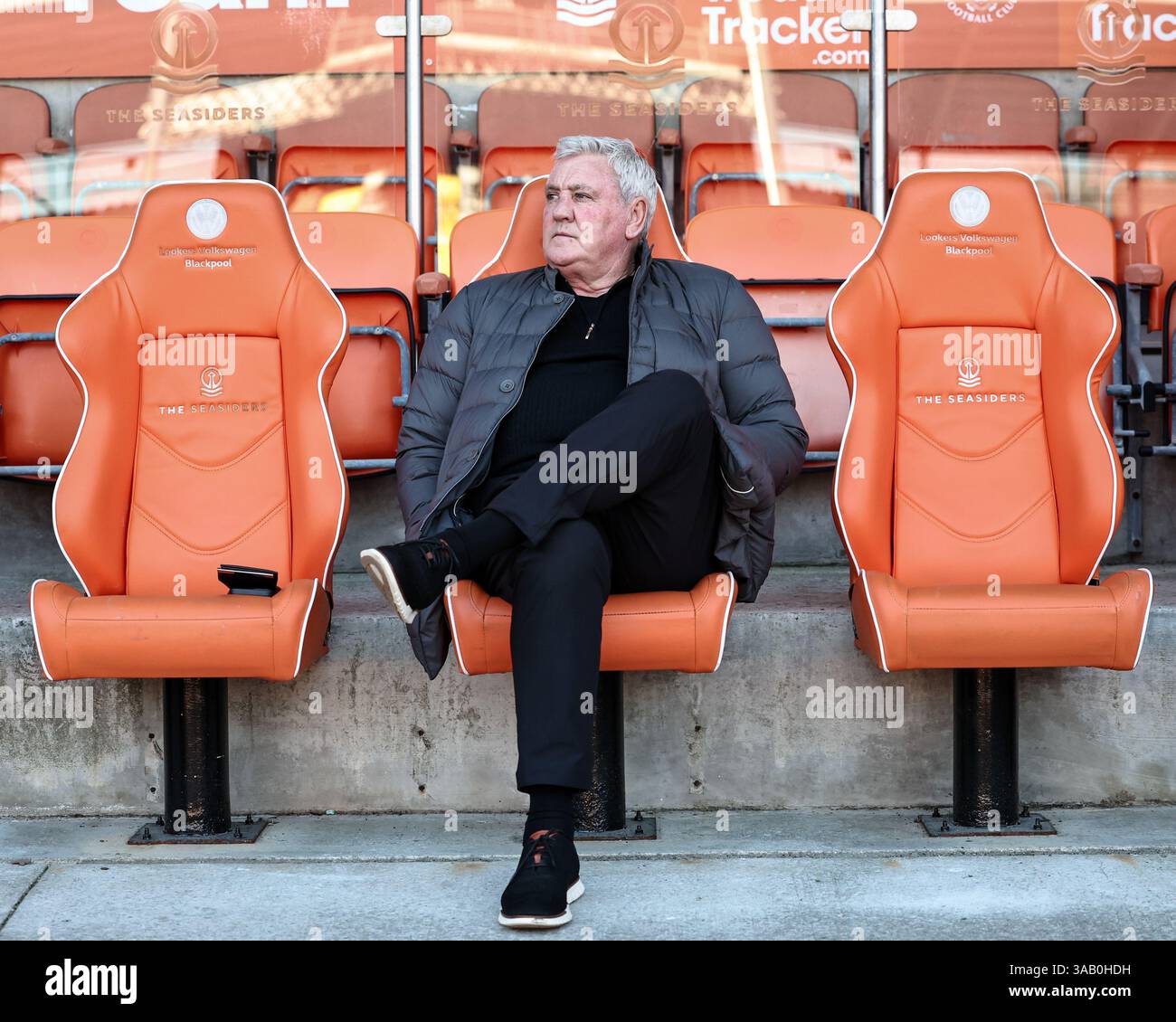 Steve Bruce manager of Blackpool sits on the bench taking a moment to ...