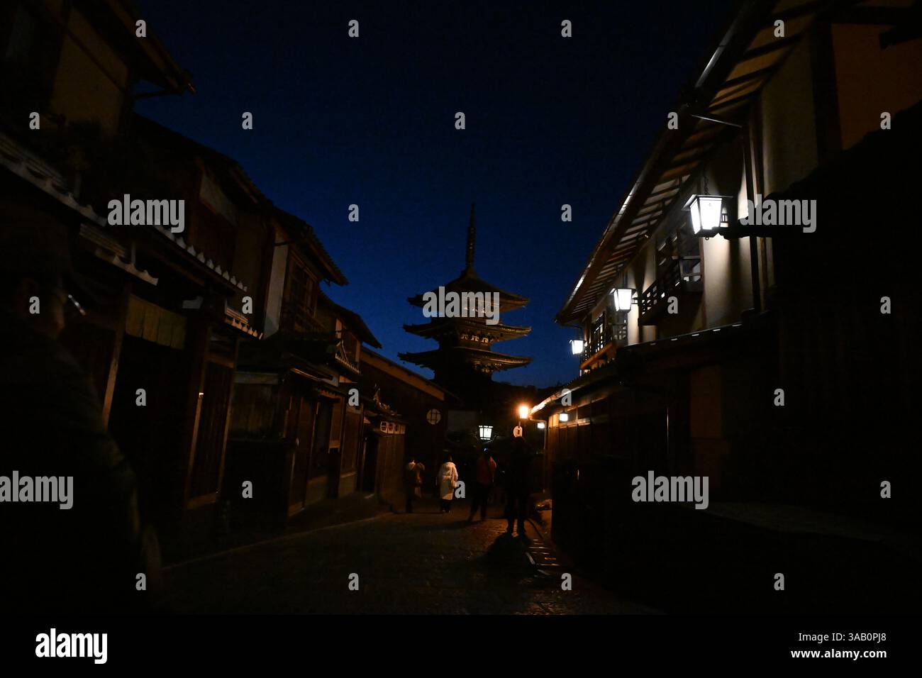 Yasaka Pagoda at twilight in Kyoto, Japan – traditional streets and illuminated temple during ...