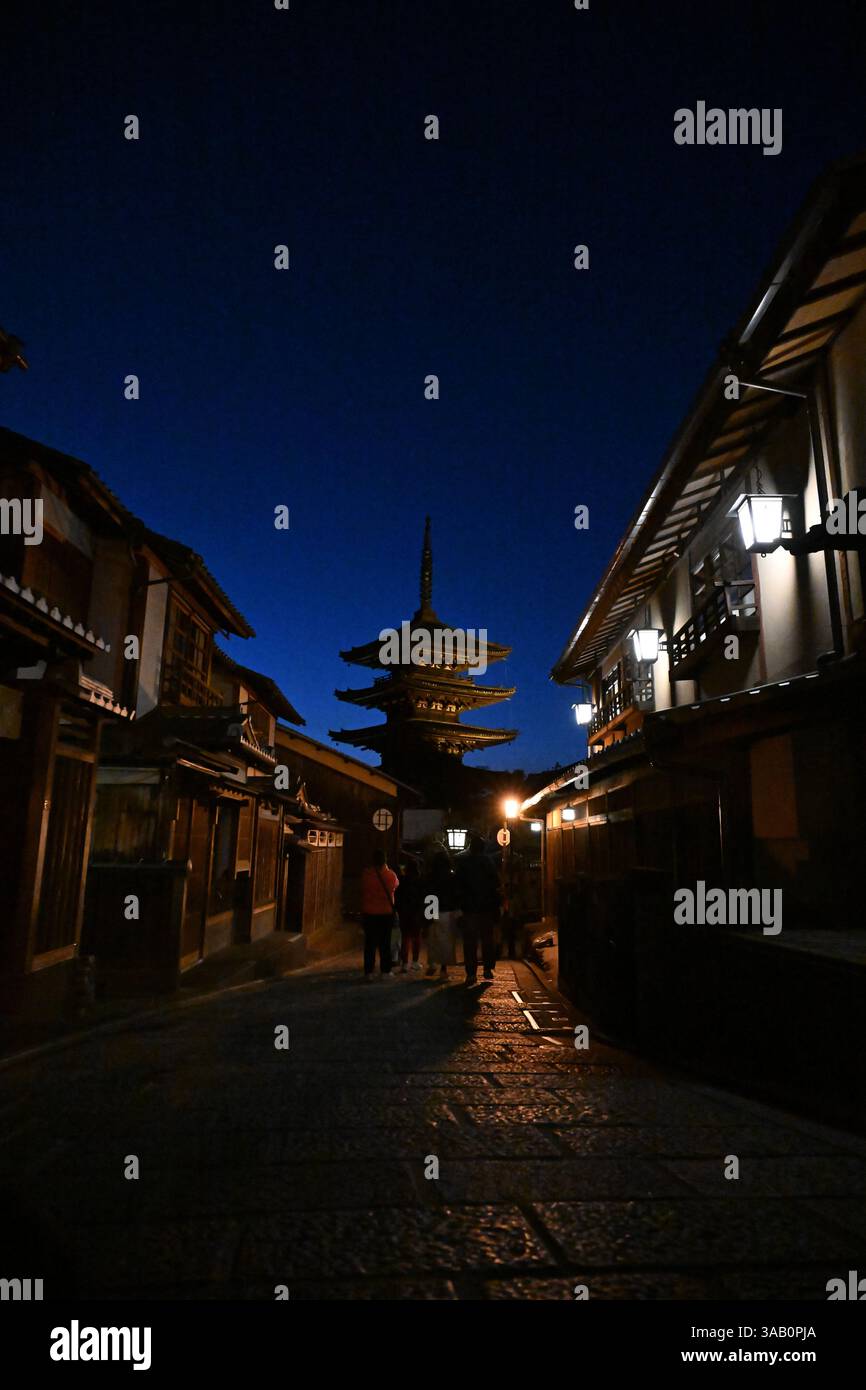 Yasaka Pagoda at twilight in Kyoto, Japan – traditional streets and illuminated temple during ...
