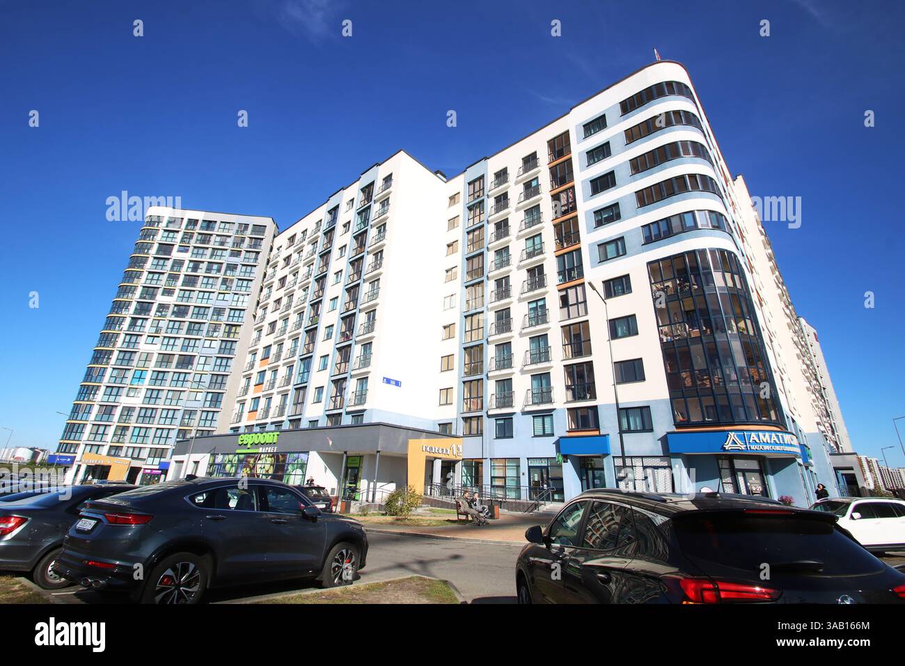 Belarus, Minsk - 04, 01,2025: Several cars are parked in front of a ...
