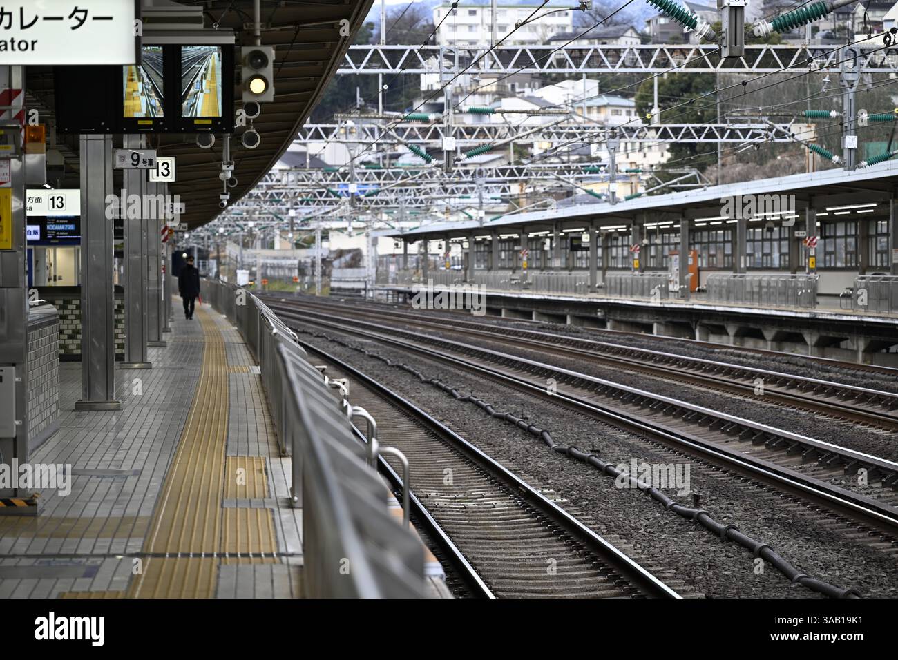 Train station platform in Tokyo, Japan – railway tracks, signage, and ...