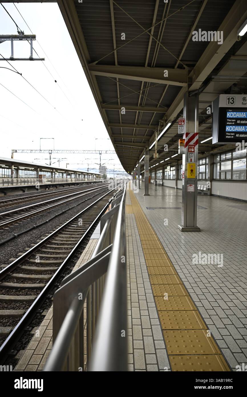 Train station platform in Tokyo, Japan – railway tracks, signage, and ...