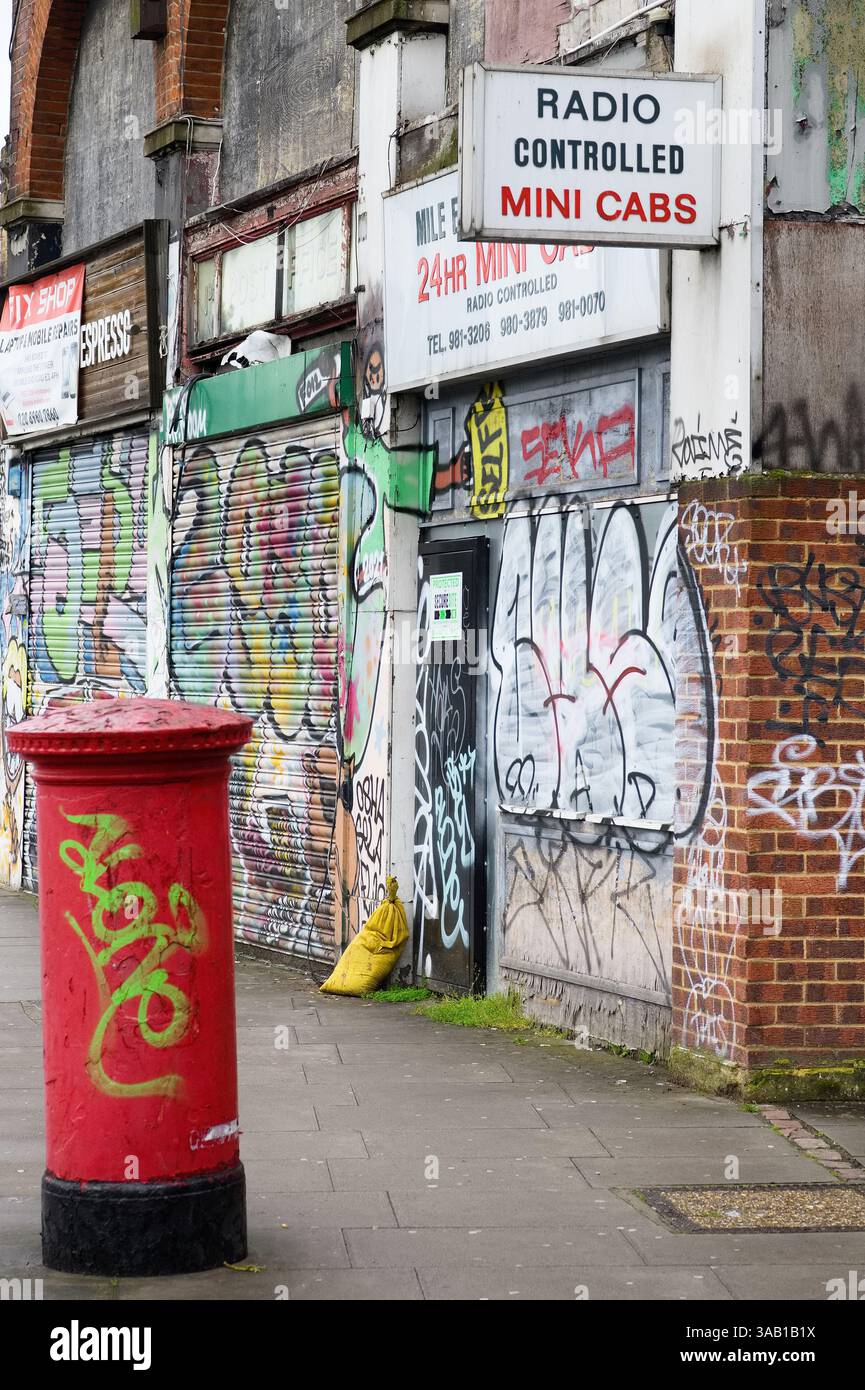 Shop front covered by graffiti hi-res stock photography and images - Alamy