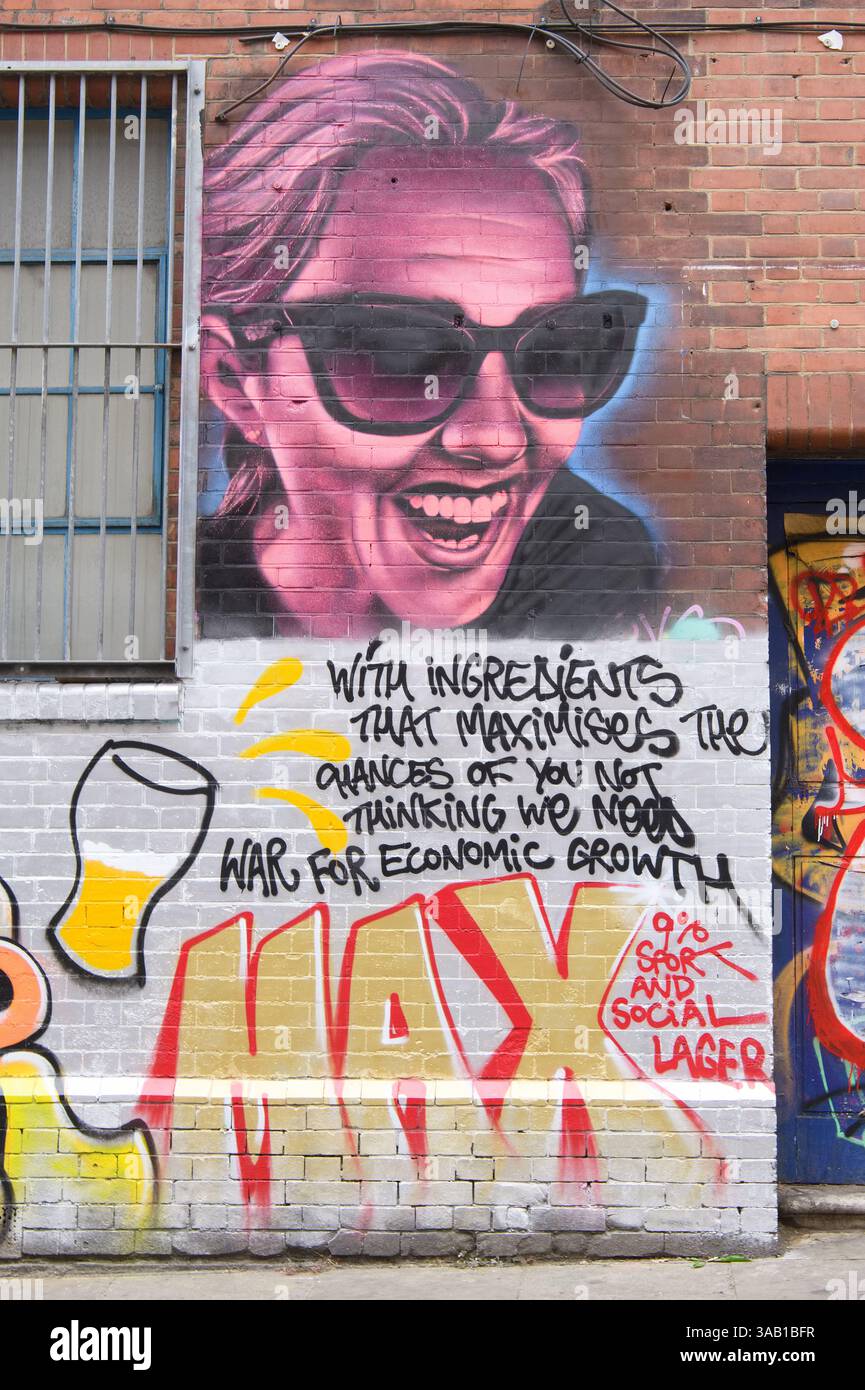 Street art on wall in Whitechapel London featuring magenta woman with ...