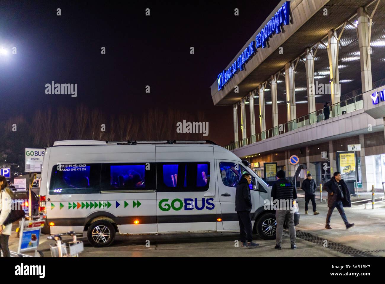 GoBus shuttle bus on Parking lot in front of Manas airport in Bishkek, Kyrgyzstan at night Stock ...