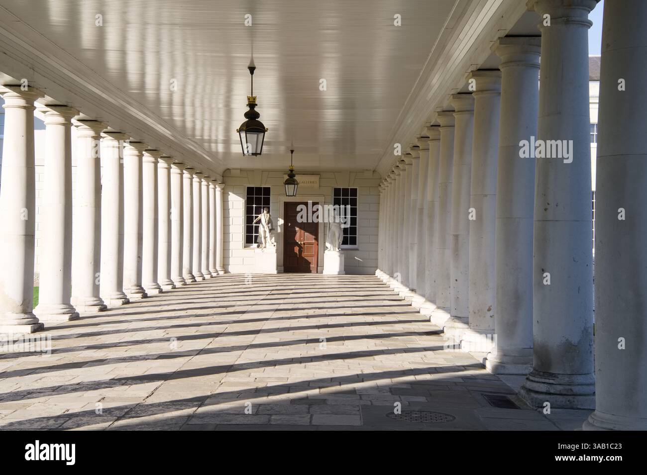 Covered walkway with pillars leading to Queen's House a former royal residence in Greenwich in ...