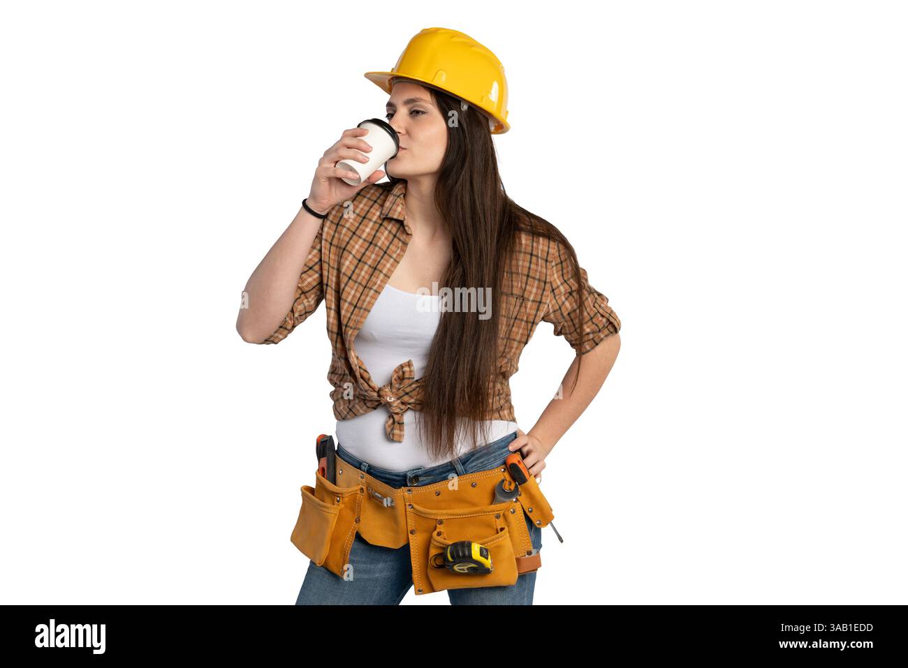 A female construction worker wearing a yellow hard hat and tool belt ...