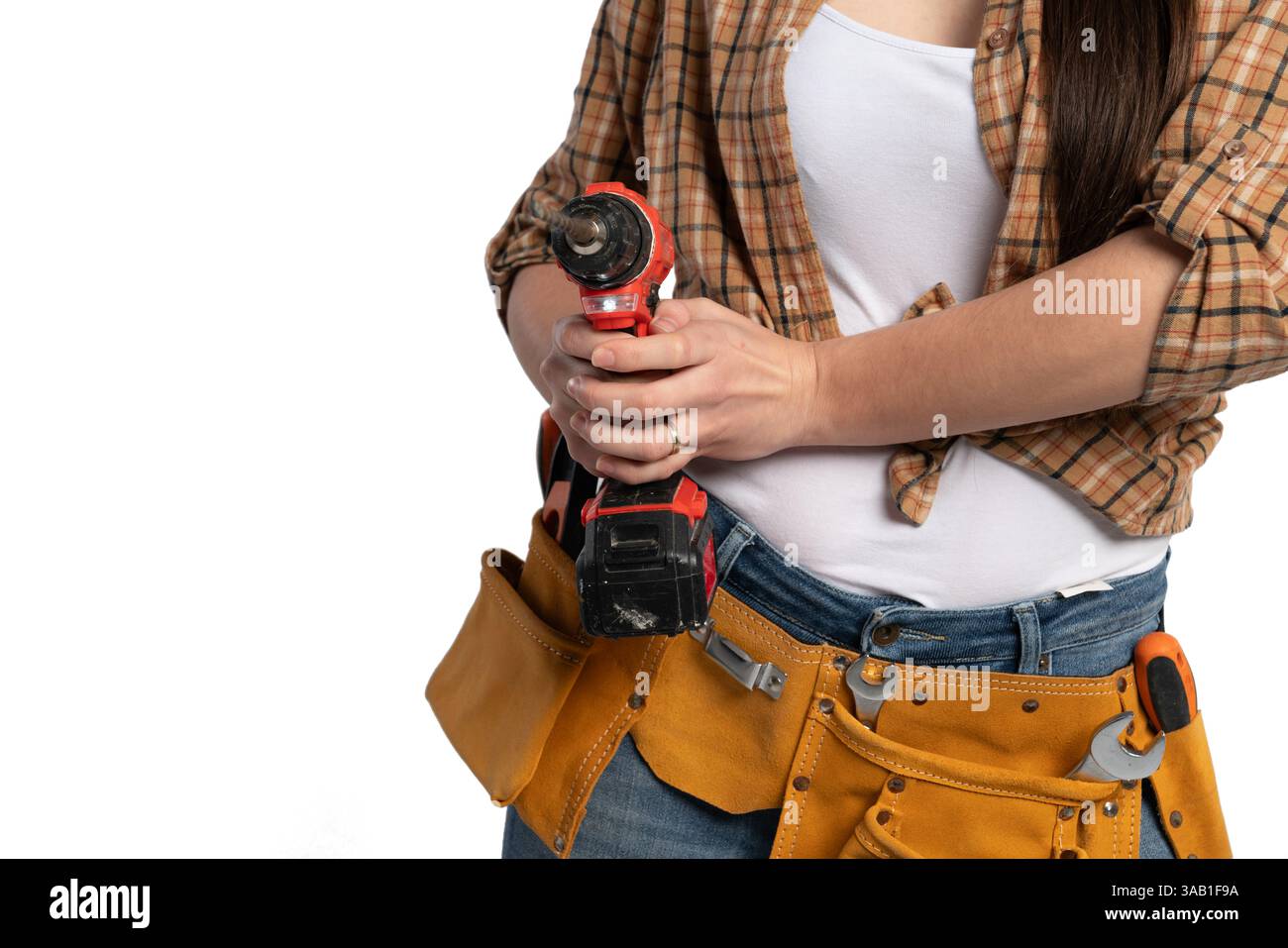 Detailed view of a female construction worker’s hands gripping a red ...