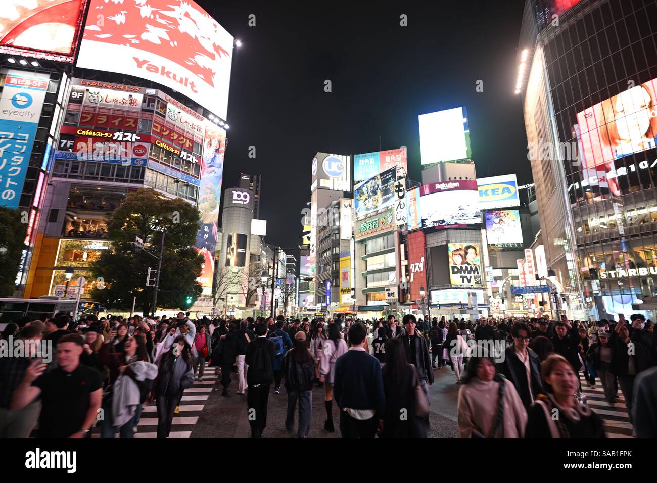 Shibuya Crossing at night in Tokyo, Japan – iconic pedestrian scramble with neon lights and ...